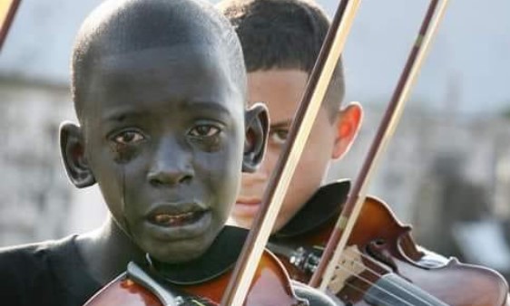A Heartwarming Picture Of A Crying Child Playing The Violin Spread ...